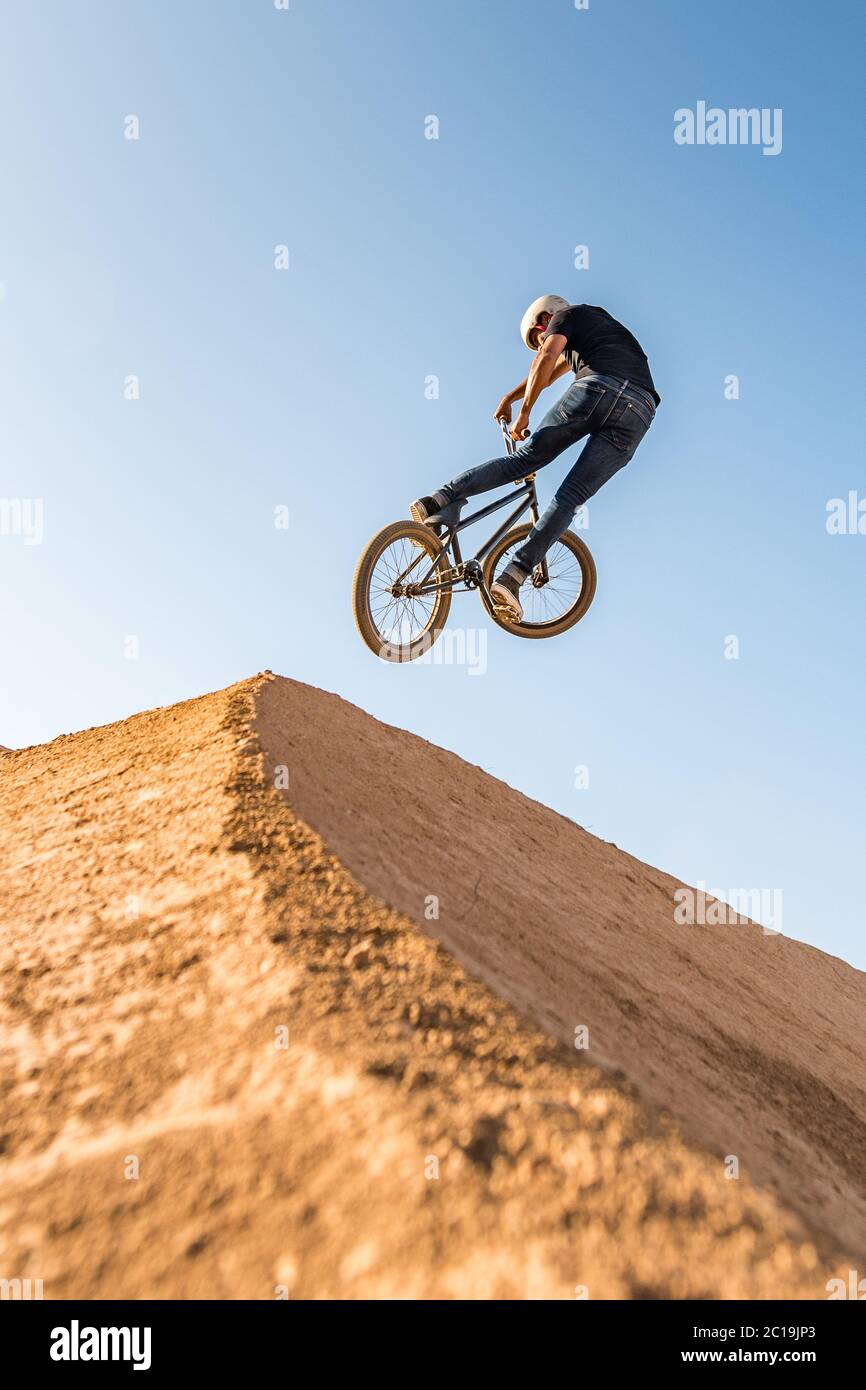 Bmx rider performing a look back at a dirt trail park Stock Photo - Alamy