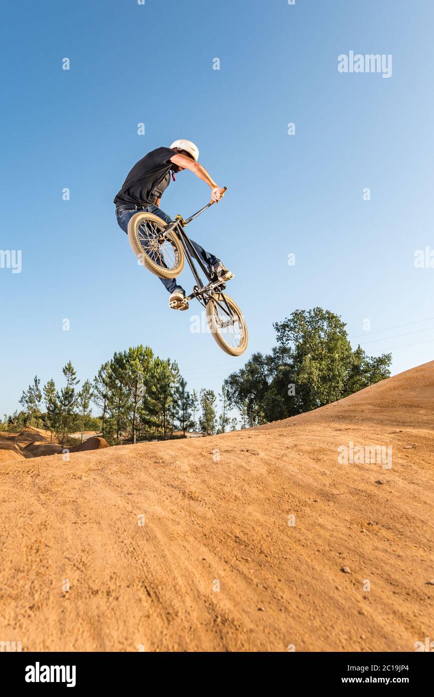 Bmx rider performing a look back at a dirt trail park Stock Photo - Alamy