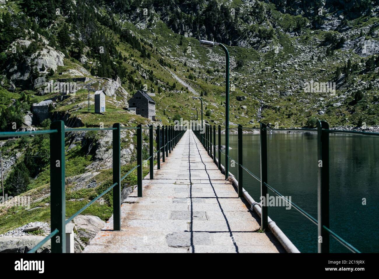 Perspective of a dam's walkway Stock Photo - Alamy