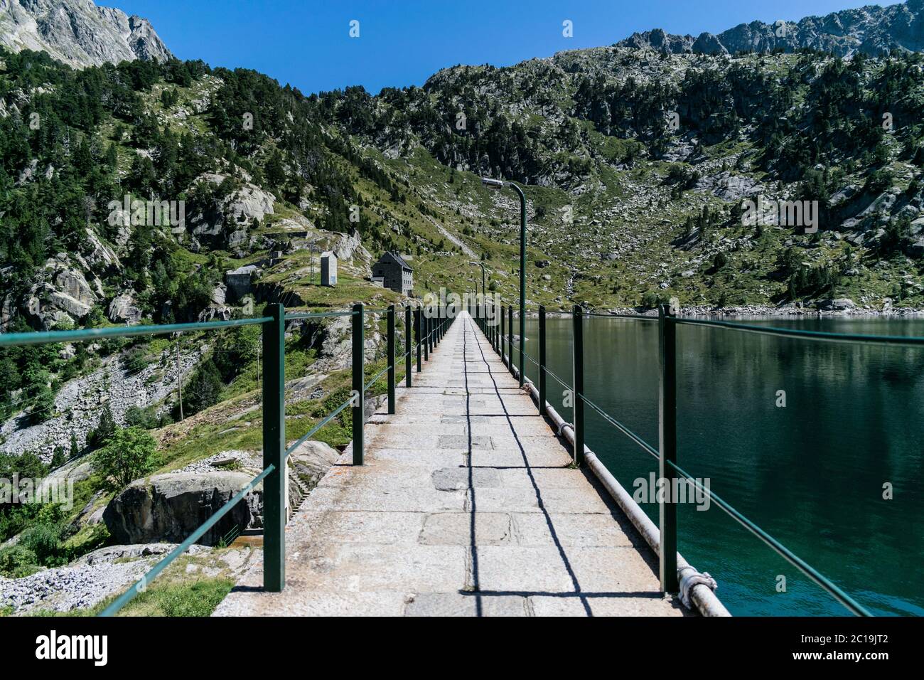 Perspective of a dam's walkway Stock Photo - Alamy