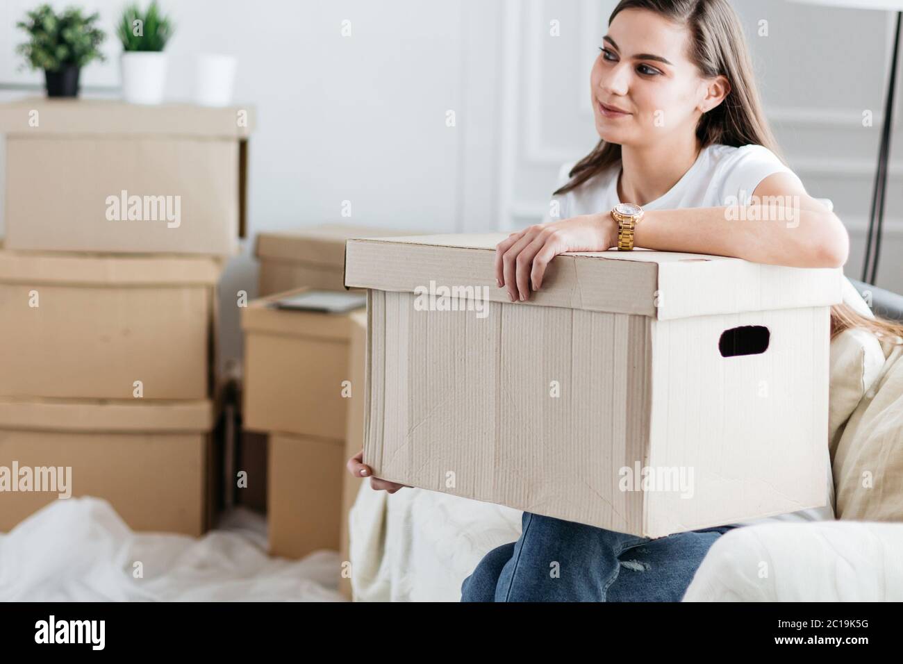Woman unpack large box hi-res stock photography and images - Alamy