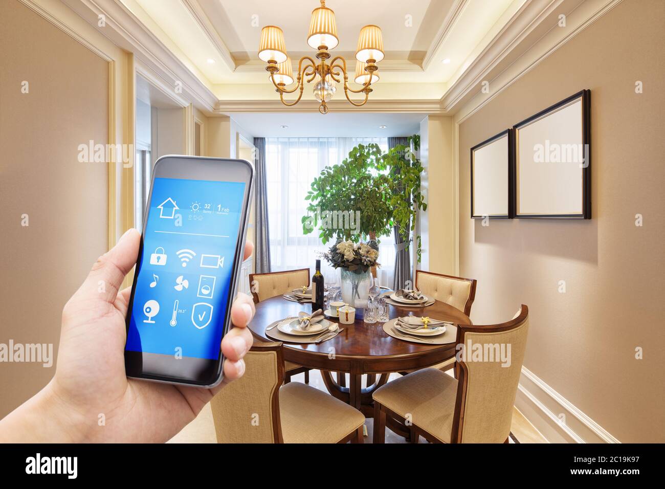 smart phone with smart home and modern dining room Stock Photo - Alamy