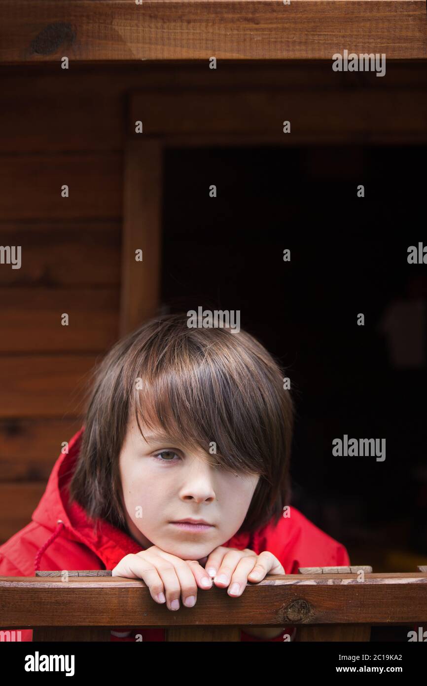 Boy hiding behind door hi-res stock photography and images - Alamy