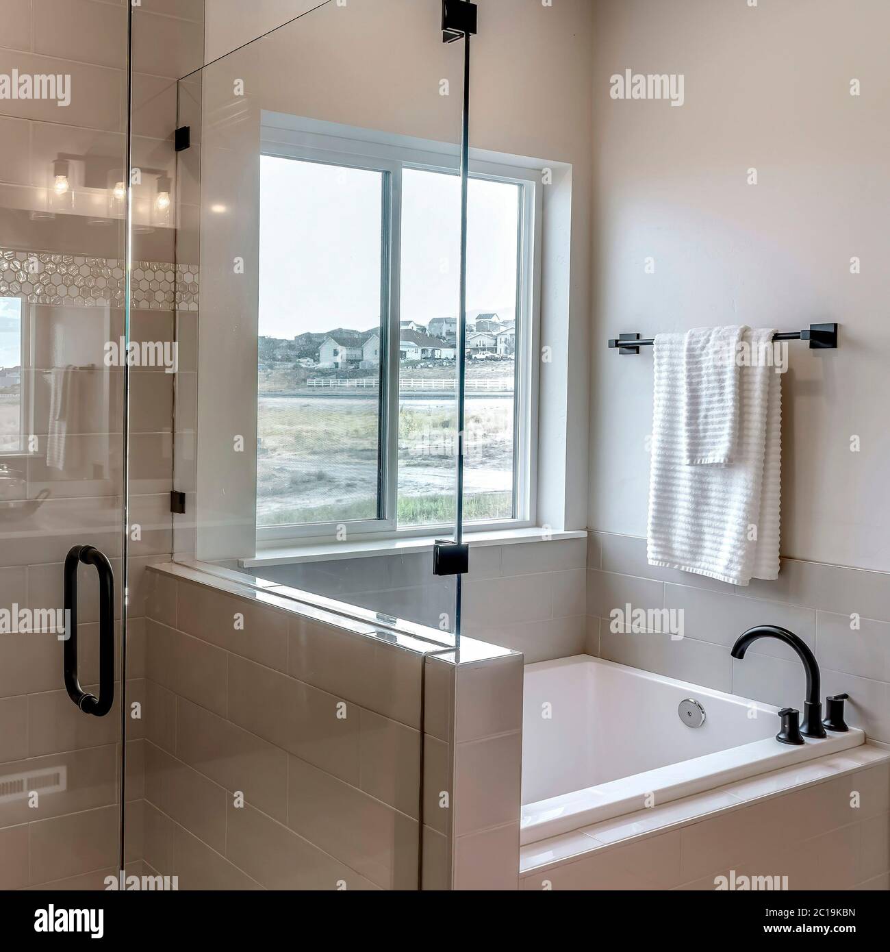 Square Frameless walk in shower stall and built in bathtub inside tile ...