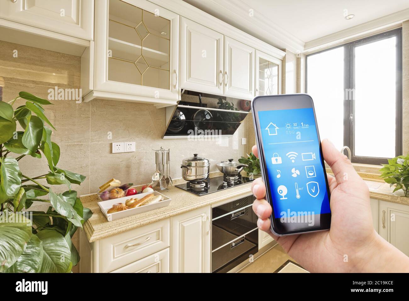 smart phone with smart home and modern kitchen Stock Photo - Alamy