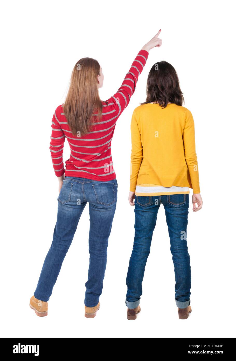 Back view of two pointing girl in sweater. Rear view people collection ...