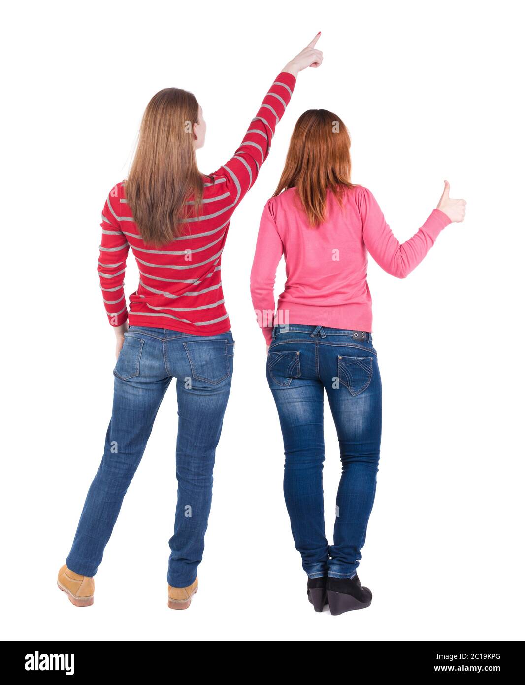 Back view of two pointing girl in sweater. Rear view people collection ...