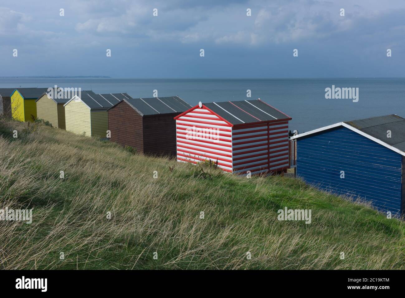 Traditional colorful English beach huts in Whitstable, Kent in the ...
