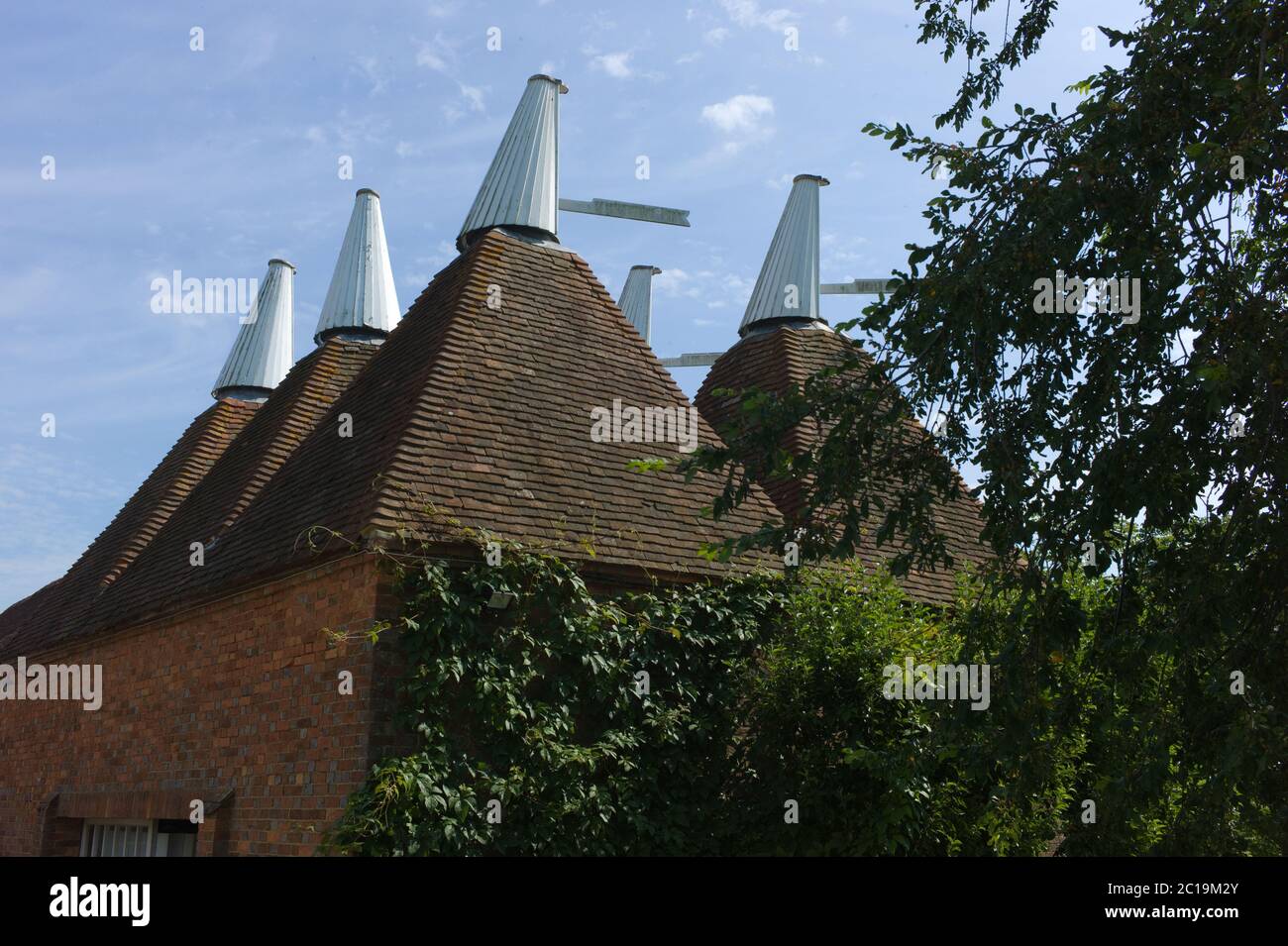 Typical oast house in Kent designed for kilning (drying) hops as part ...