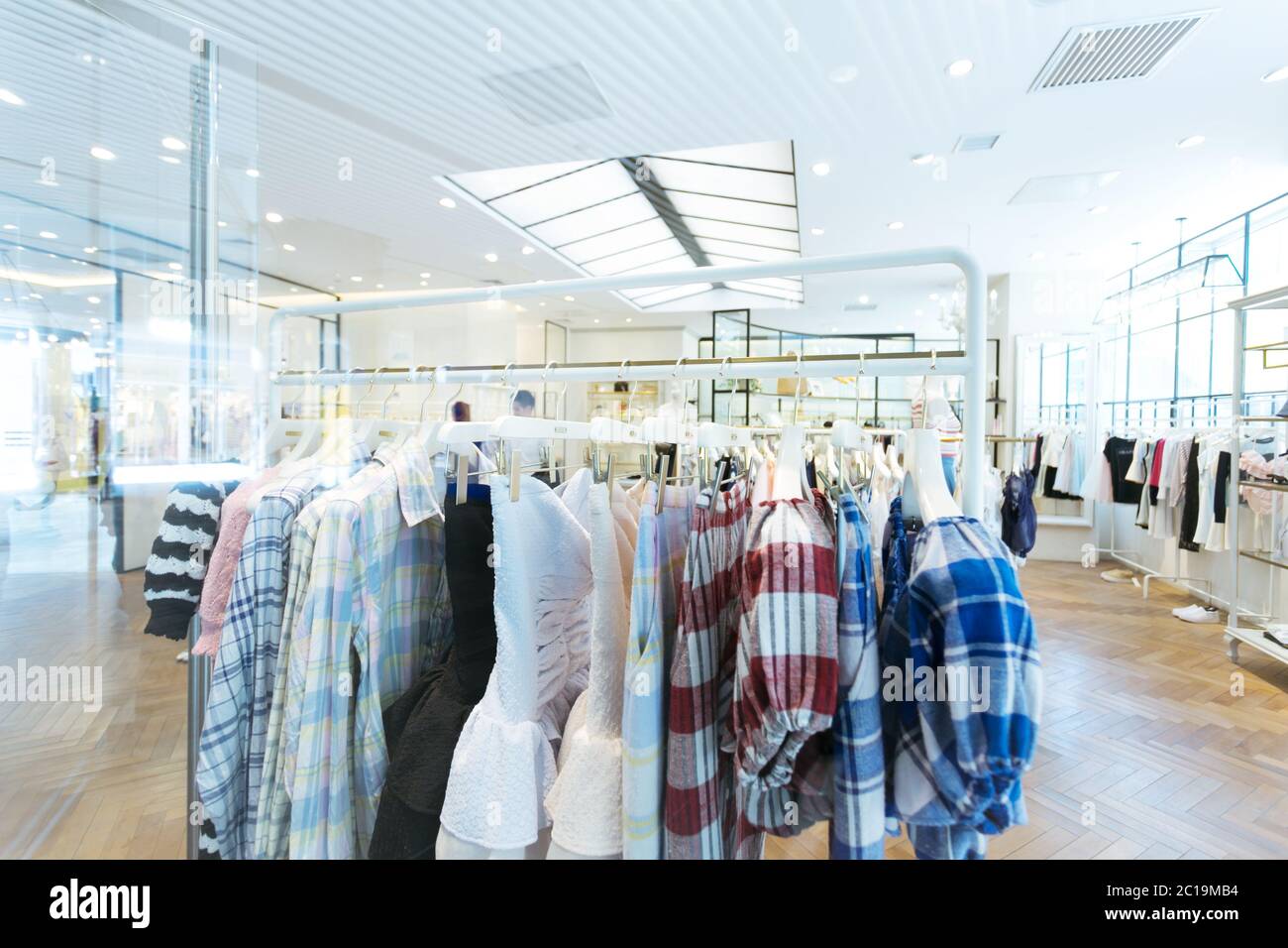 fashionable clothes in modern shopping mall Stock Photo - Alamy