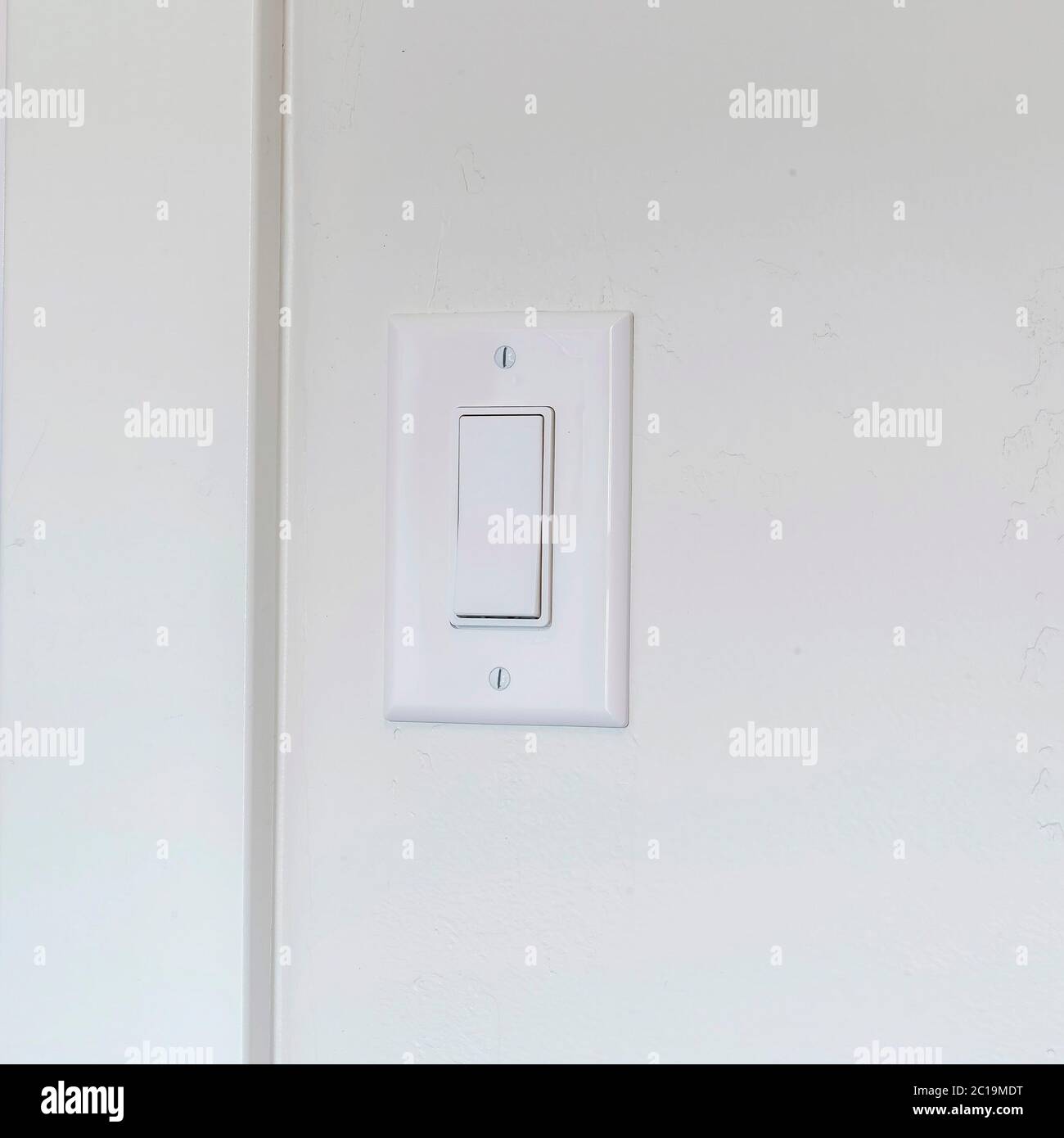 Square frame Indoor electrical light switch of home mounted on white ...