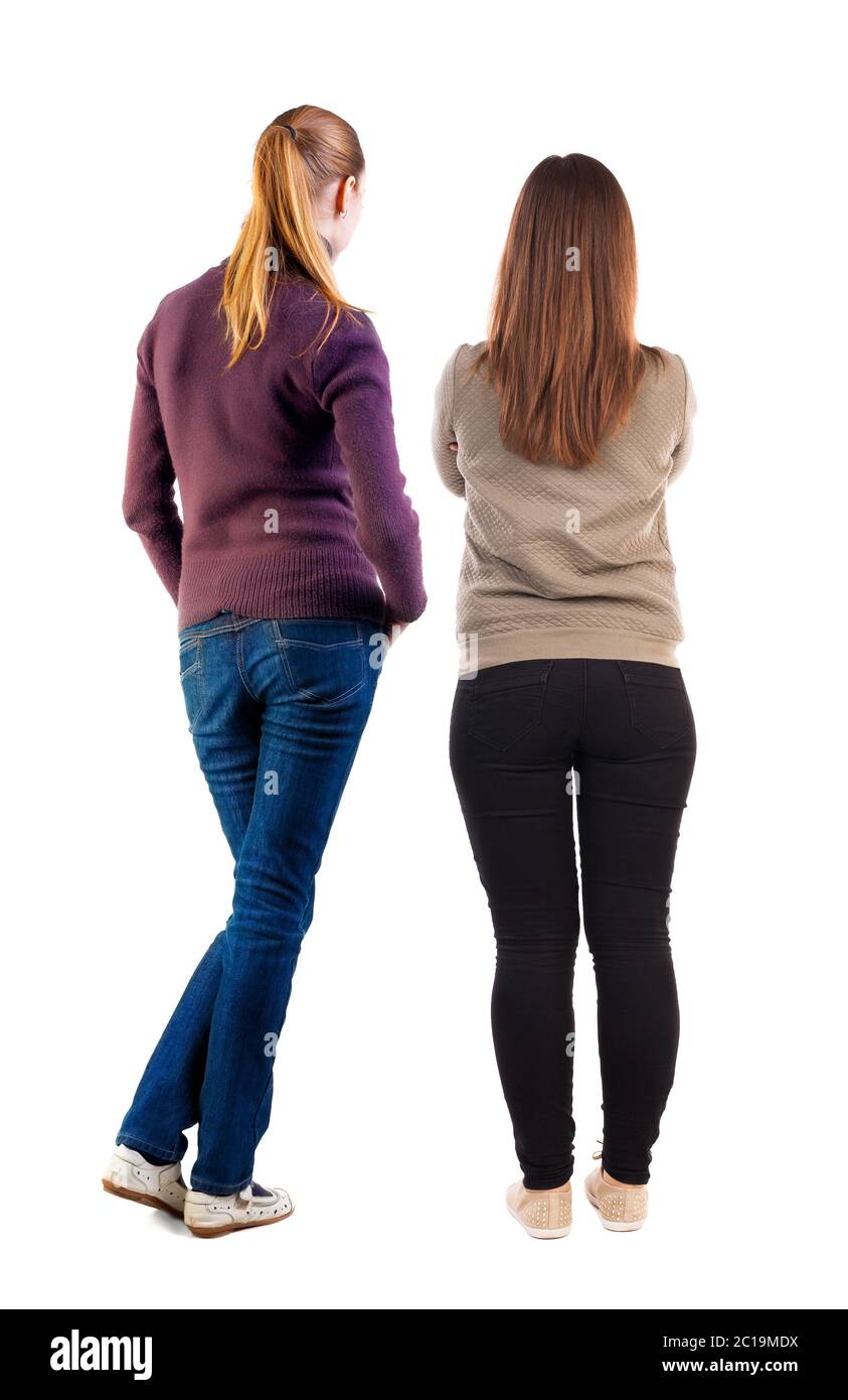 Back view of two woman in sweater. Rear view people collection ...
