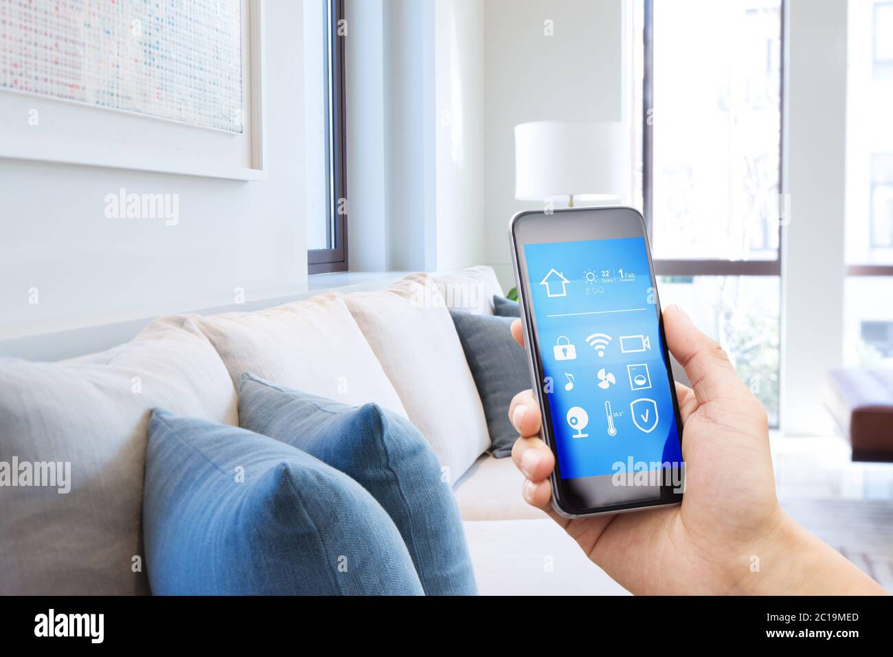 smart phone with smart home with modern living room Stock Photo - Alamy