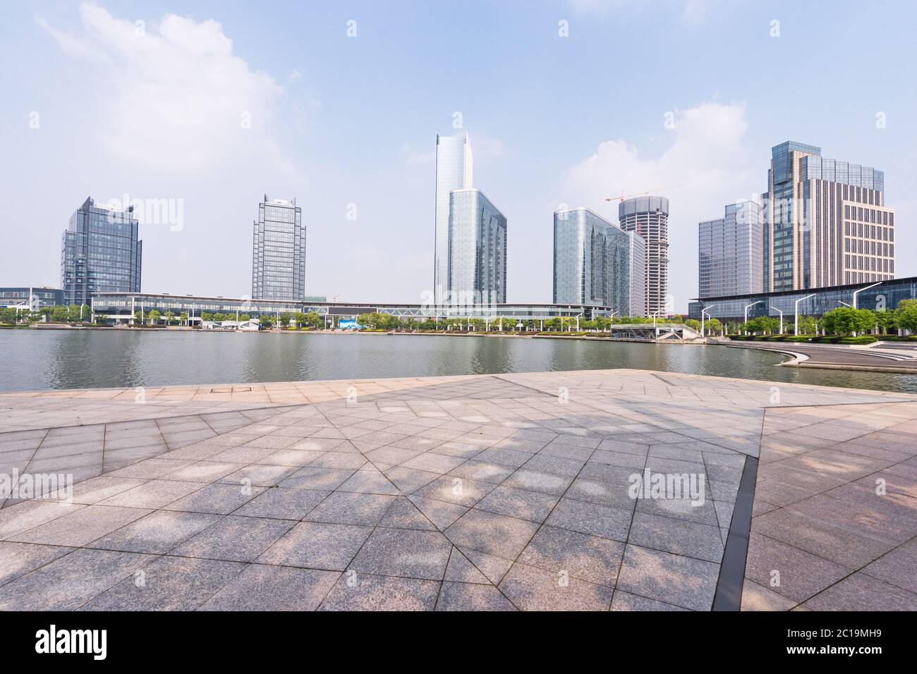 modern buildings near water in modern city Stock Photo - Alamy