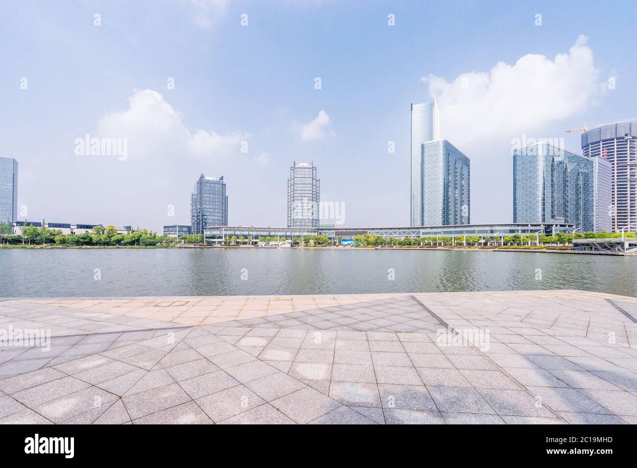 modern buildings near water in modern city Stock Photo - Alamy