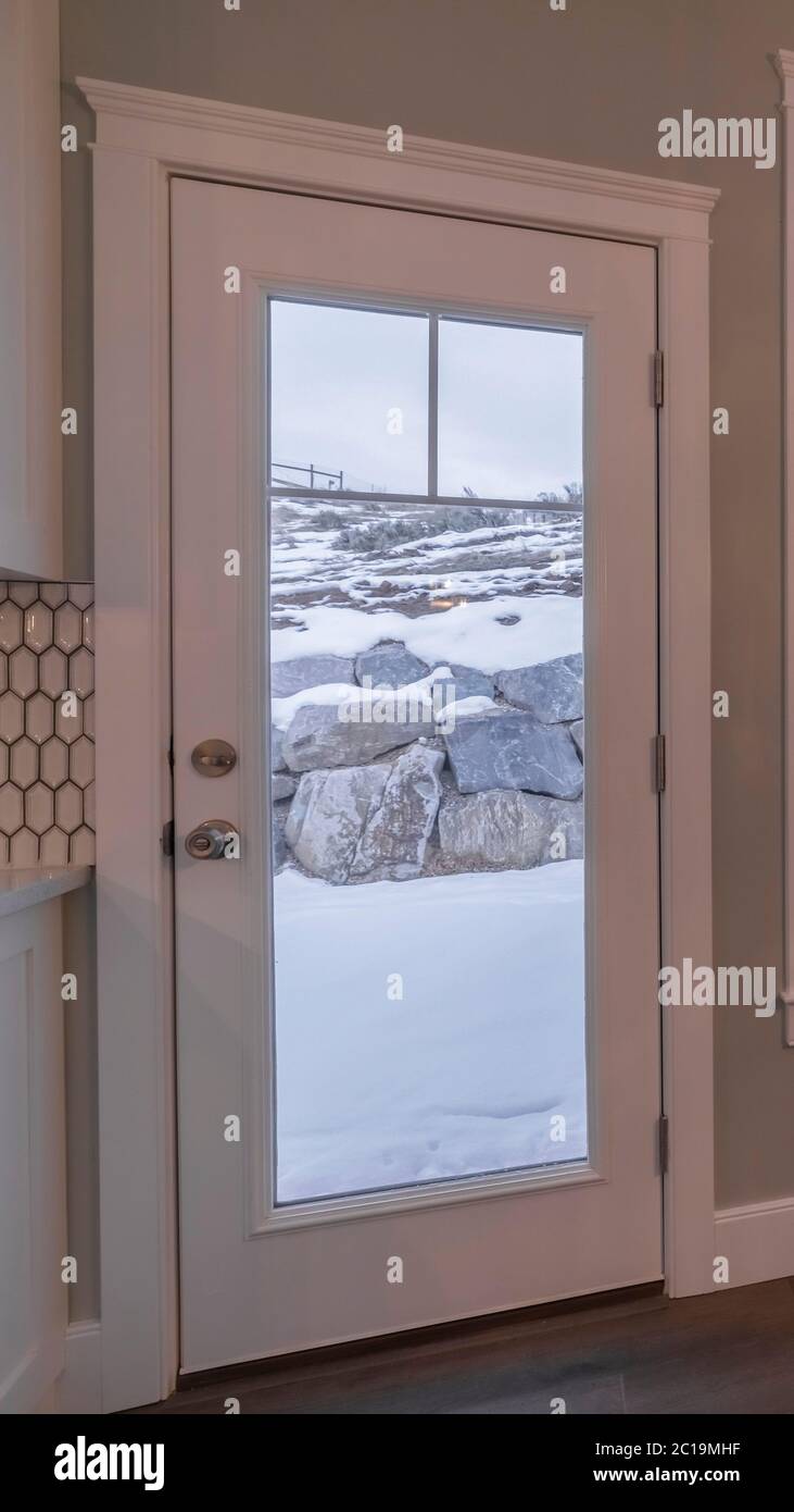 Vertical crop Looking out through a glass door and windows Stock Photo ...
