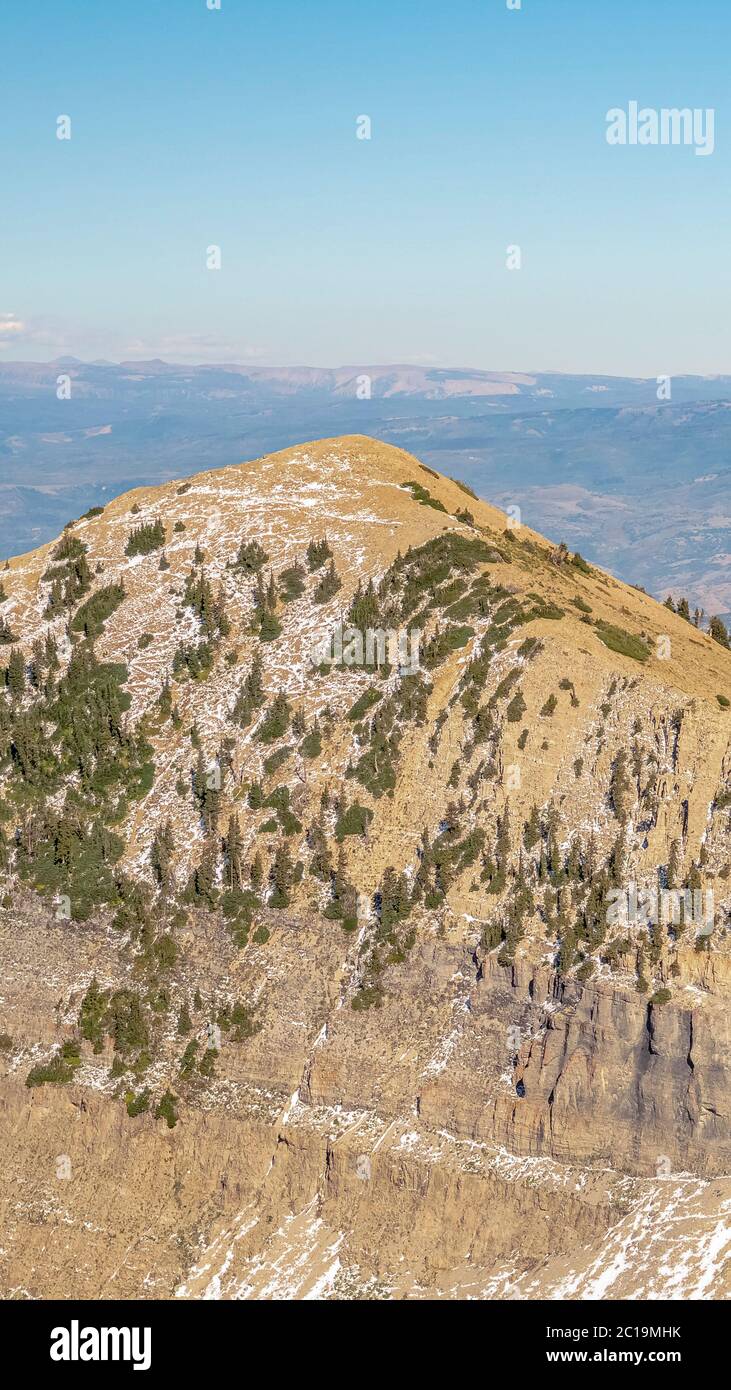 Vertical crop Steep cliffs at summit of Mount Timpanogos, Utah Stock ...