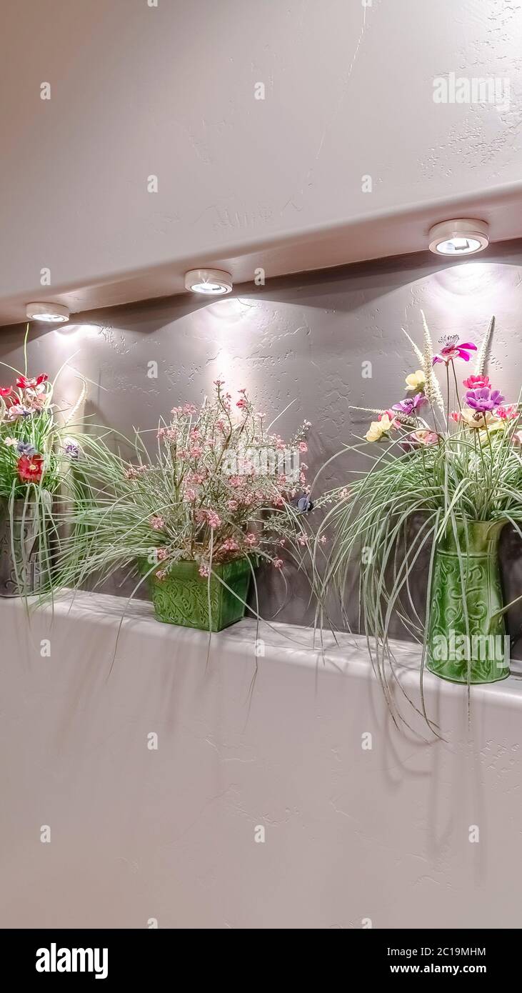 Vertical crop Flower arrangements in a recessed alcove interior Stock ...