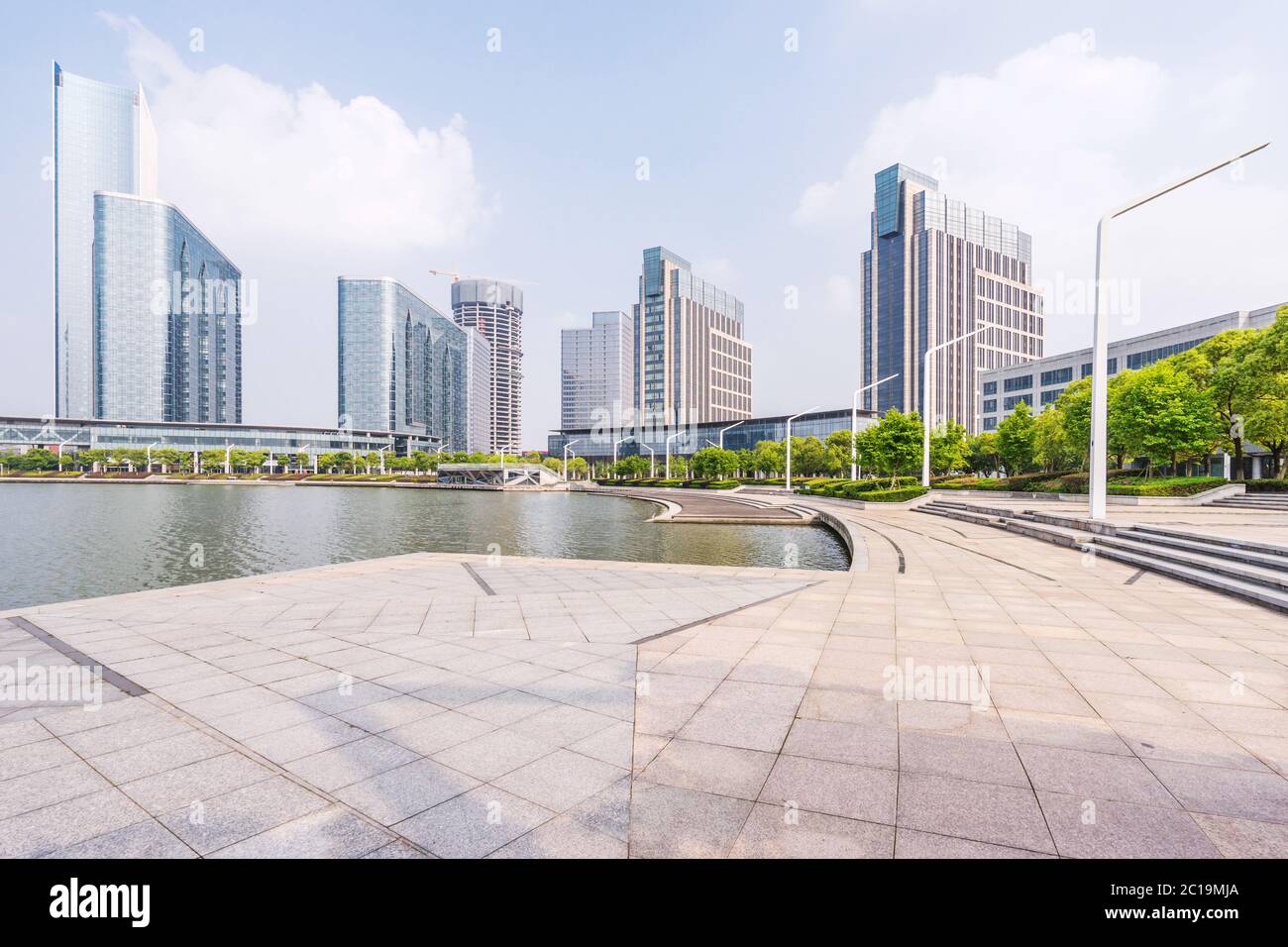 modern buildings near water in modern city Stock Photo - Alamy