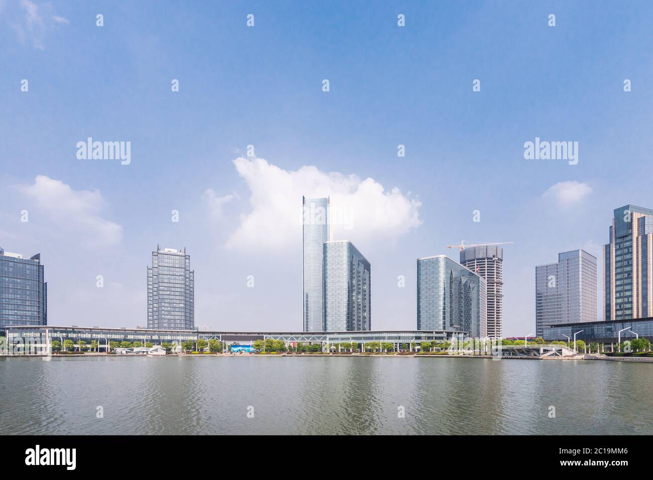 modern buildings near water in modern city Stock Photo - Alamy
