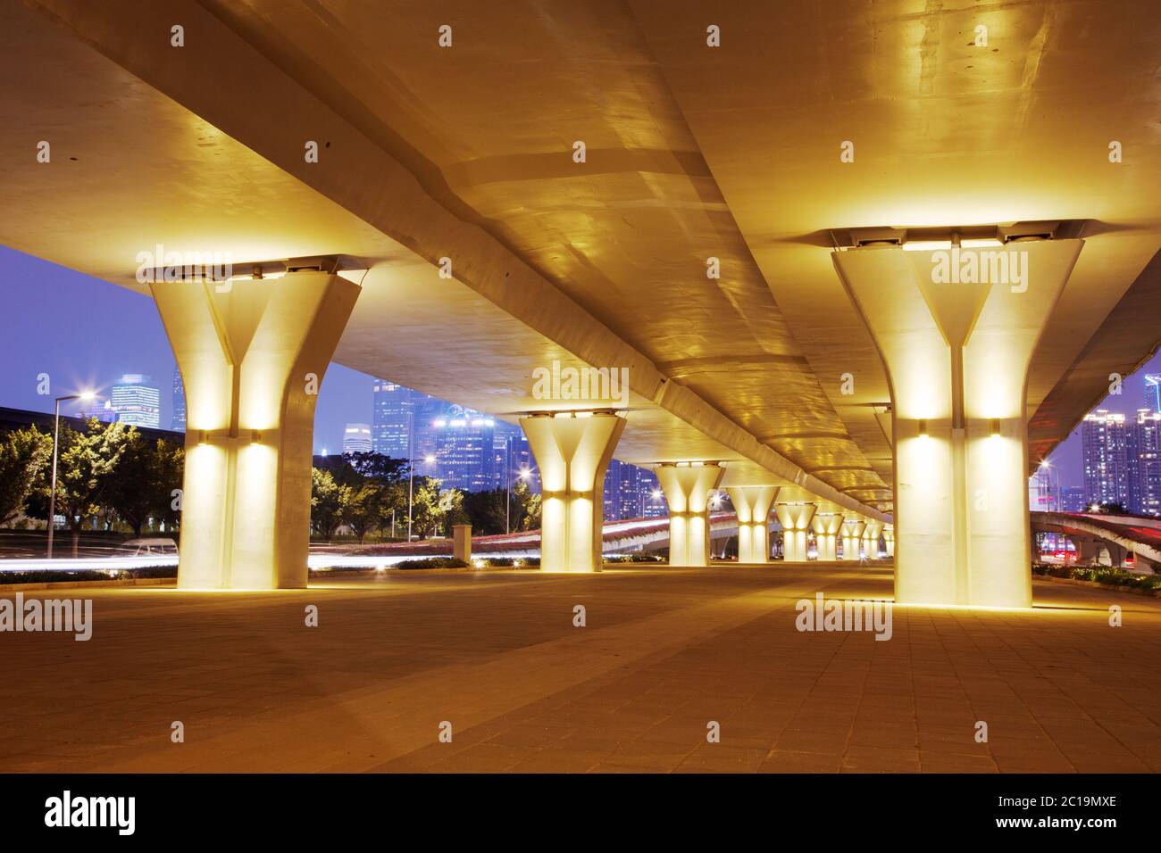 empty sidewalk below elevated road in modern city Stock Photo - Alamy