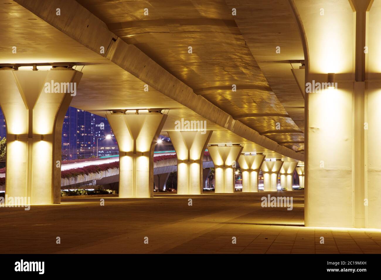 empty sidewalk below elevated road in modern city Stock Photo - Alamy