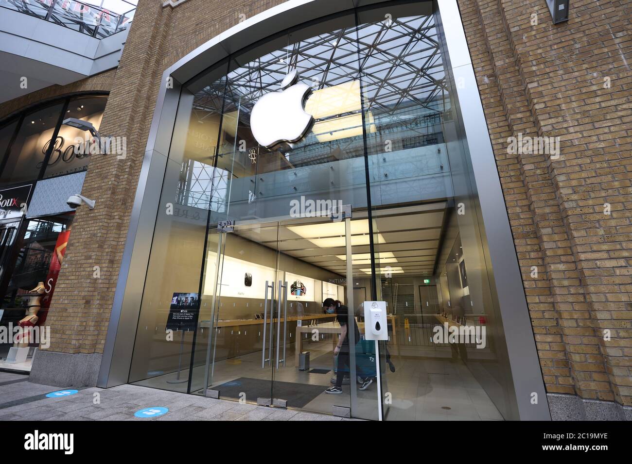 Staff at the Apple Store in Belfast???s Victoria Square prepare to ...