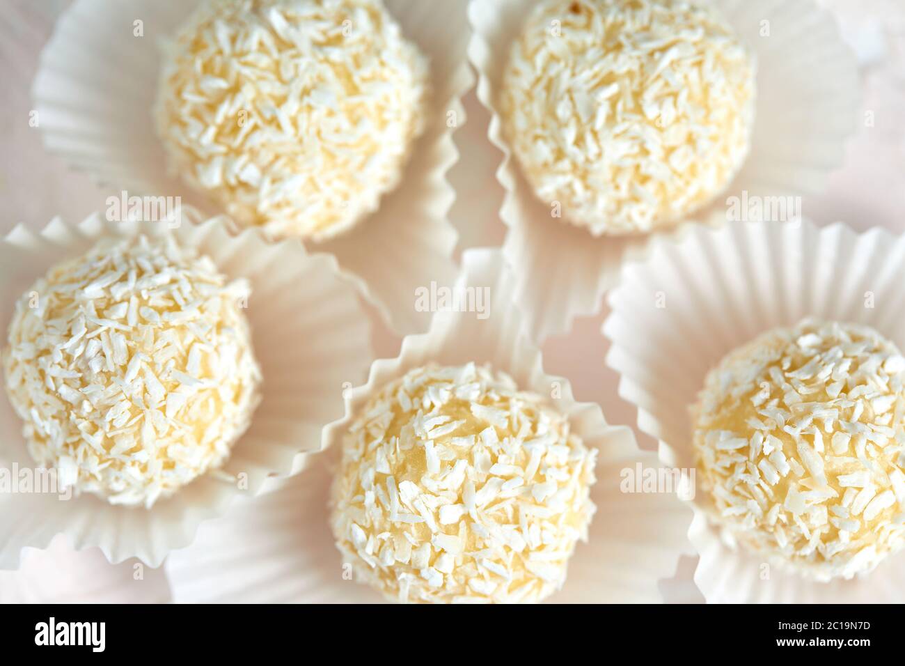 Candies covered by shredded coconut. coconut balls with coconut flakes ...