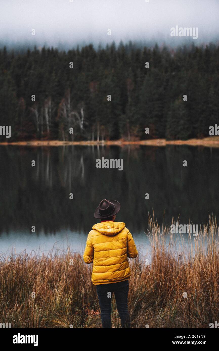 Person with yellow jacket hi-res stock photography and images - Alamy