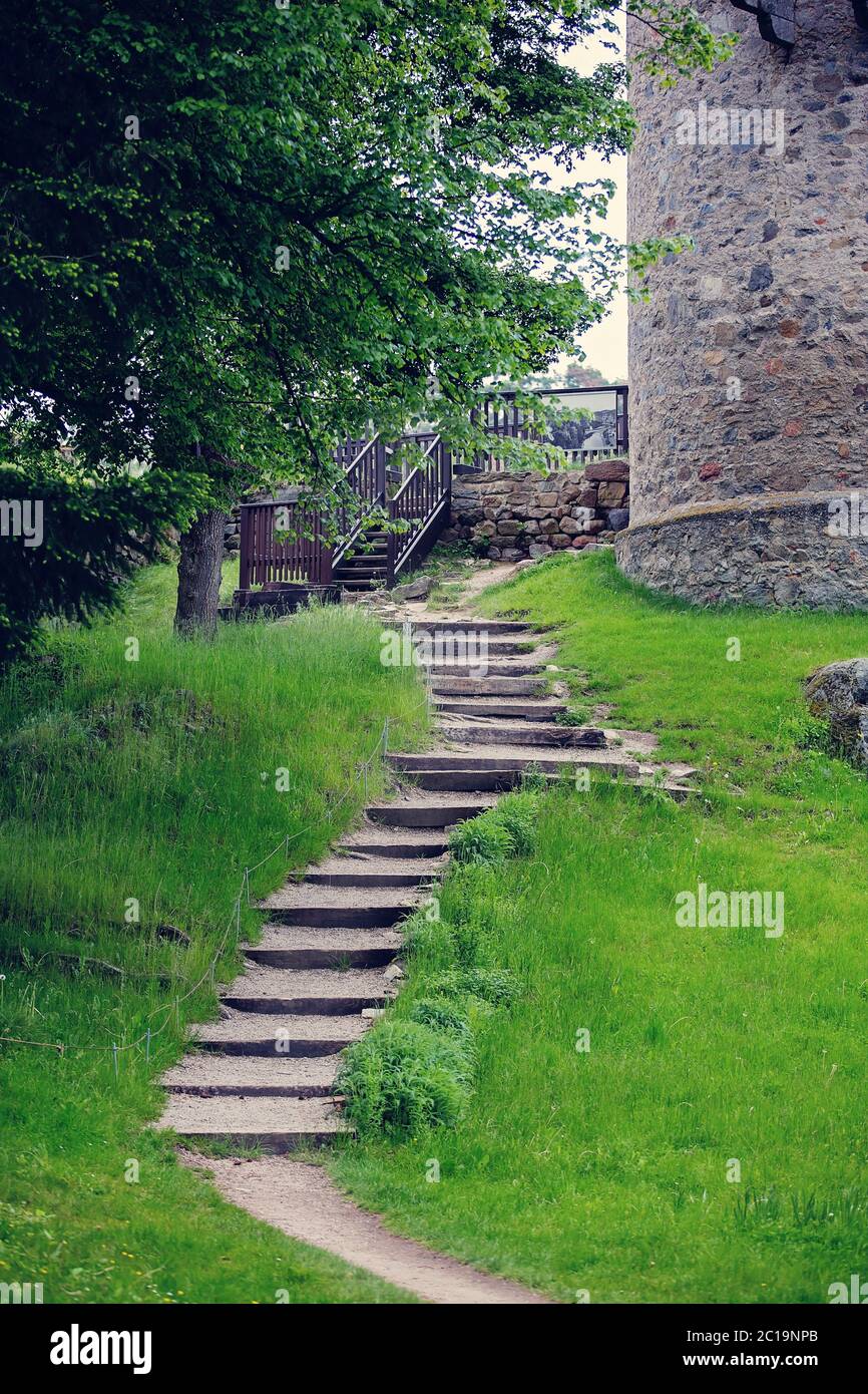 Forest path with steps in park with trees and stone building Stock ...