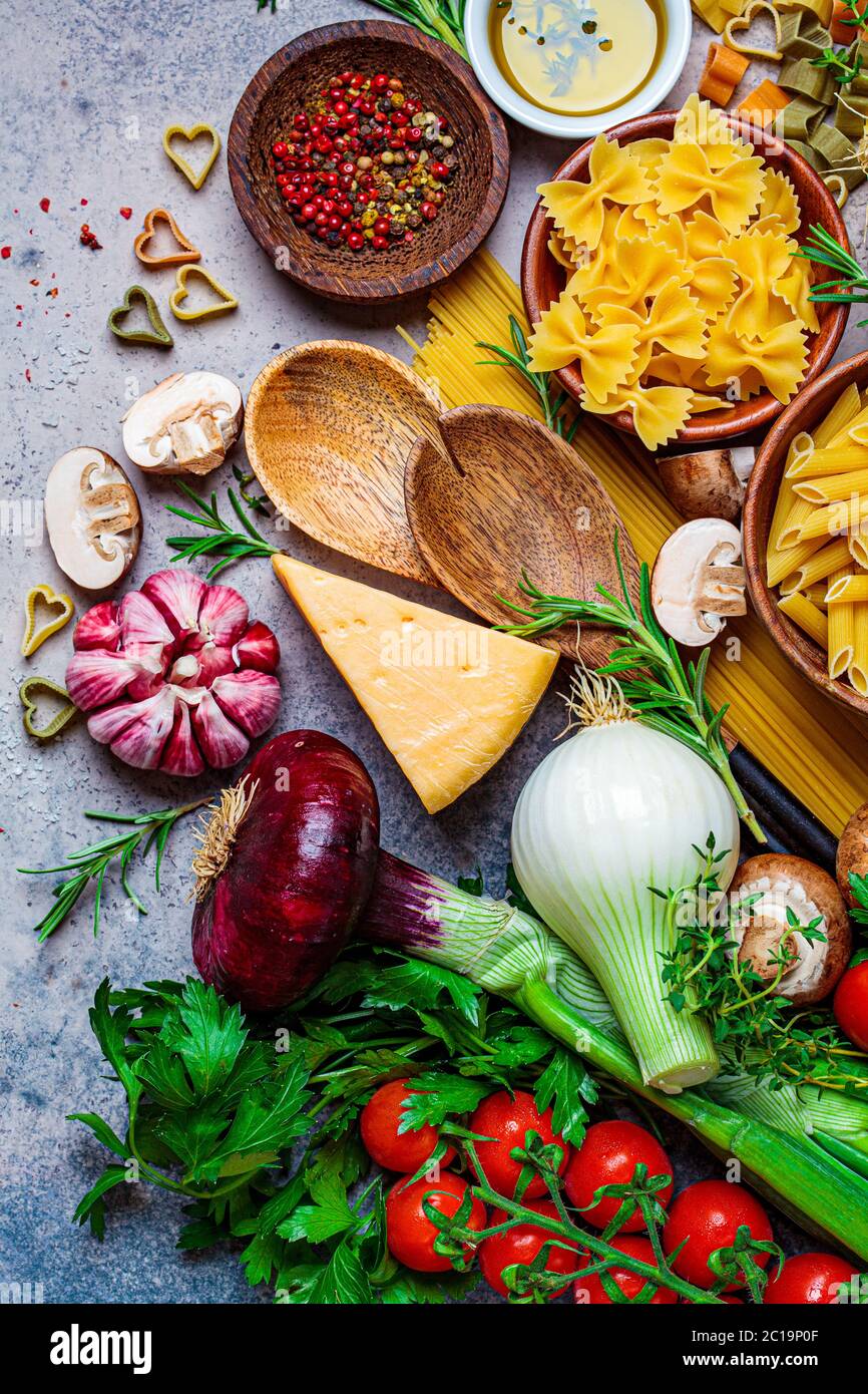 Cooking pasta ingredients background. Raw ingredients for the ...