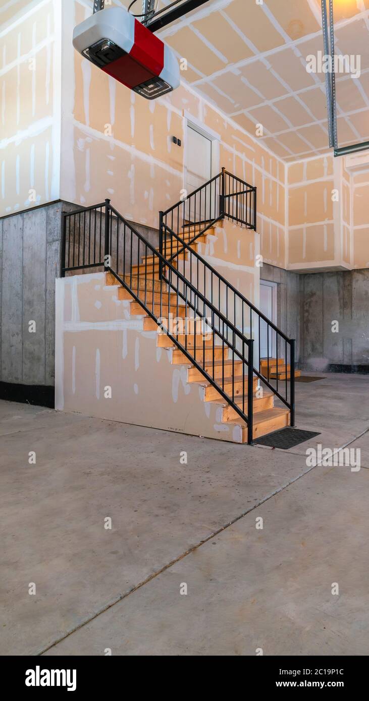 Vertical Empty open plan basement in a modern house Stock Photo - Alamy