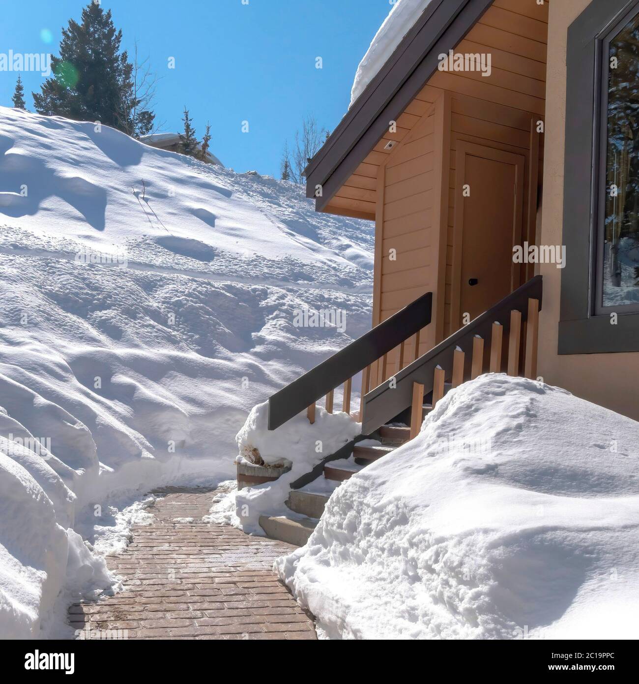 Square frame Stone brick pathway and stairs leading to home entrance ...