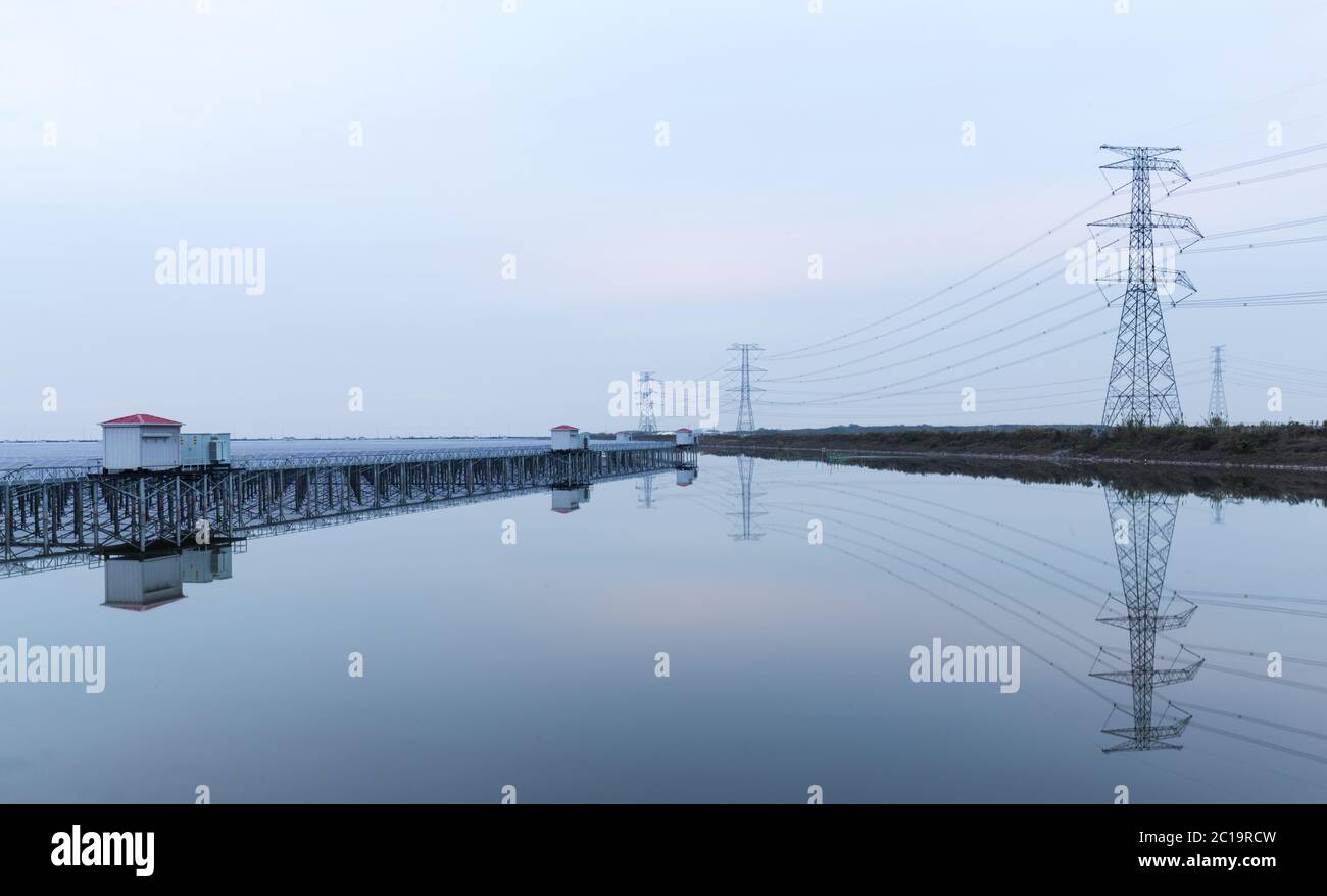 beautiful river and high pylons in cloud sky Stock Photo - Alamy