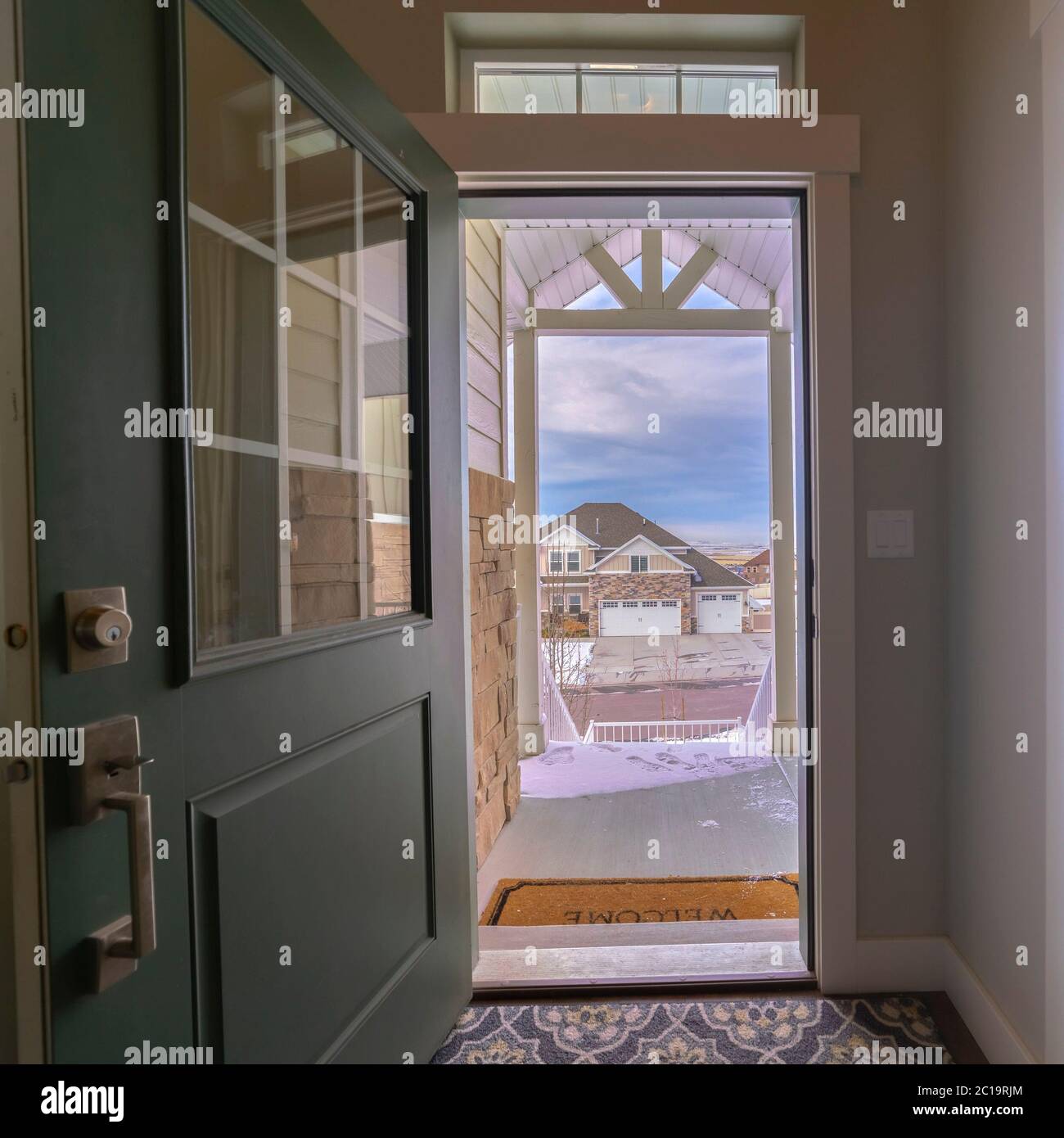 Square View through the open door from inside a home Stock Photo - Alamy