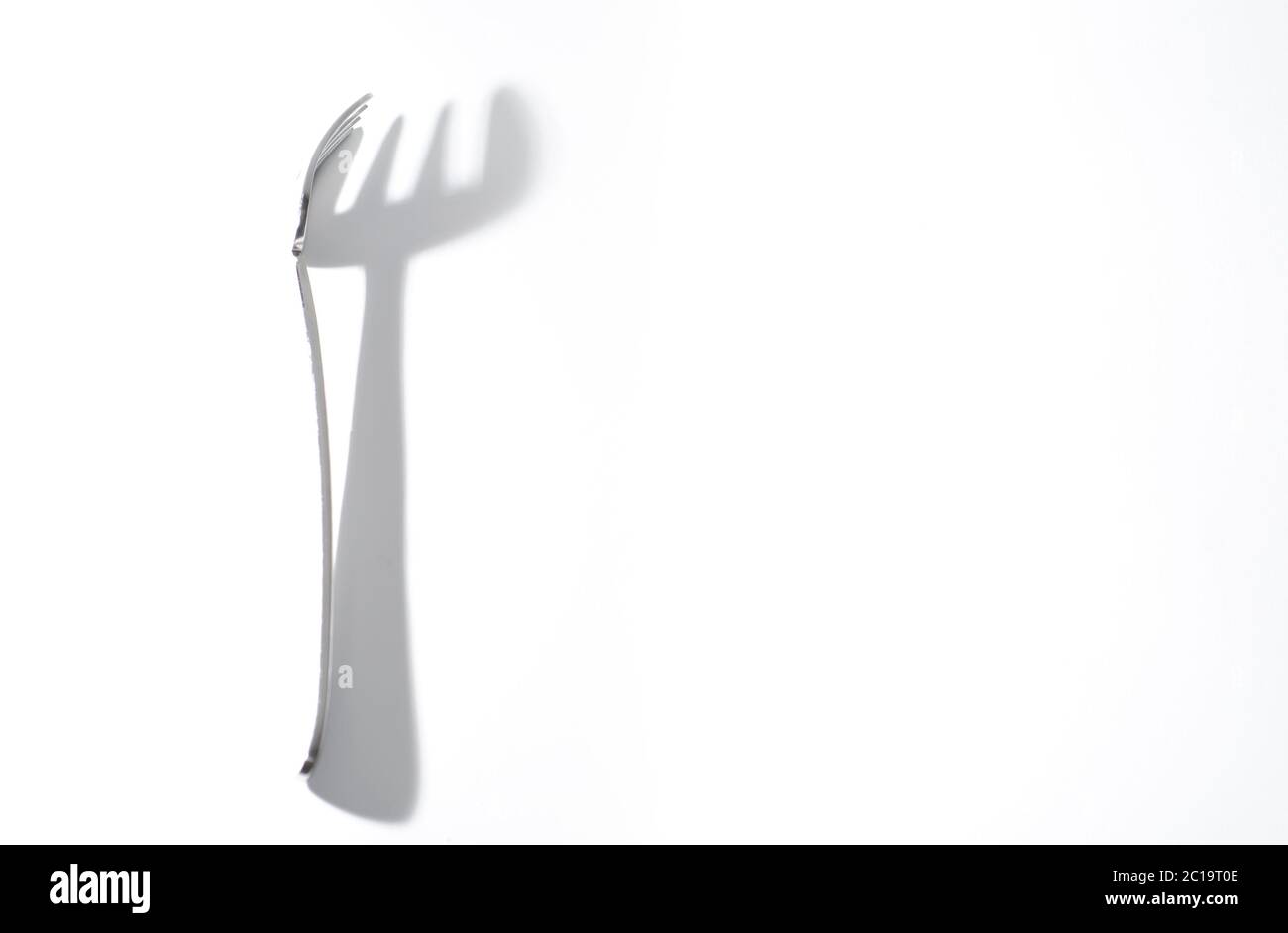 Fork with Shadow on White Background Stock Photo - Alamy