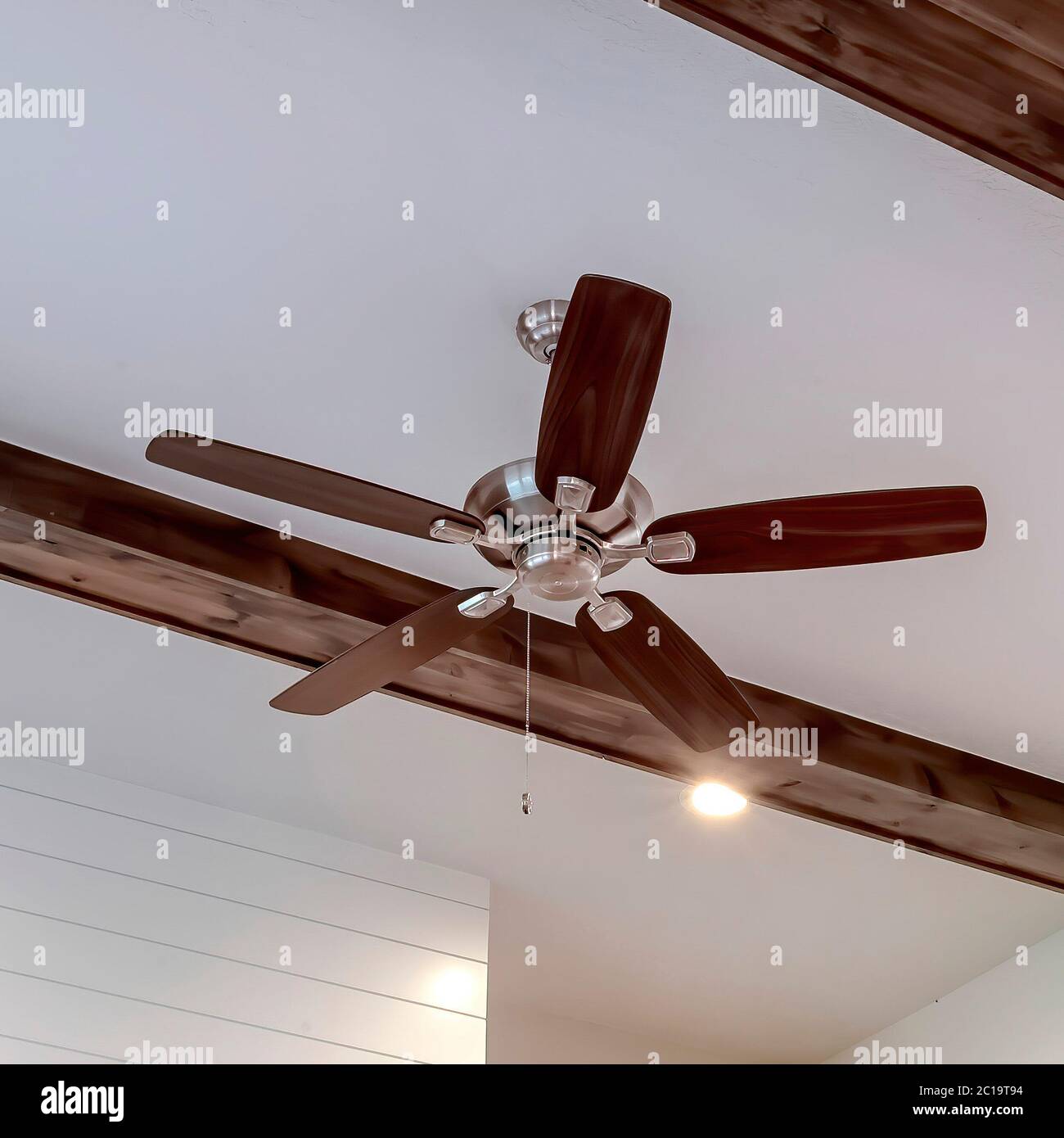 Square Wood beams and recessed bulbs with ceiling fan and lights at the ...