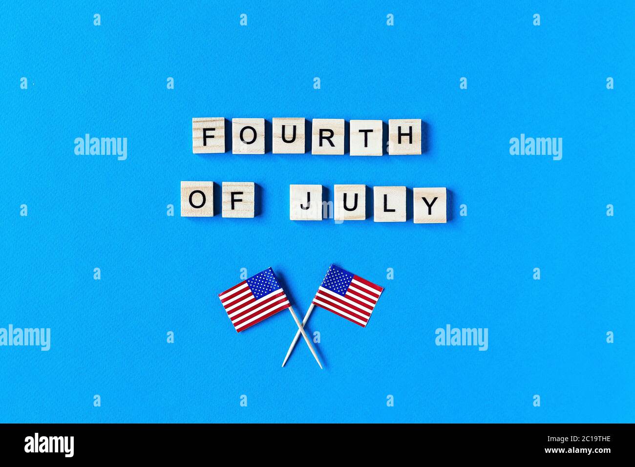 the inscription July 4 in wooden letters on a blue background. Design ...