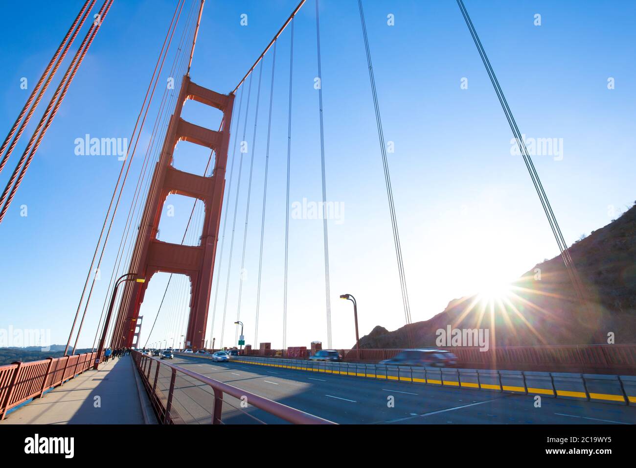 gold gated bridge in sunny sky Stock Photo - Alamy