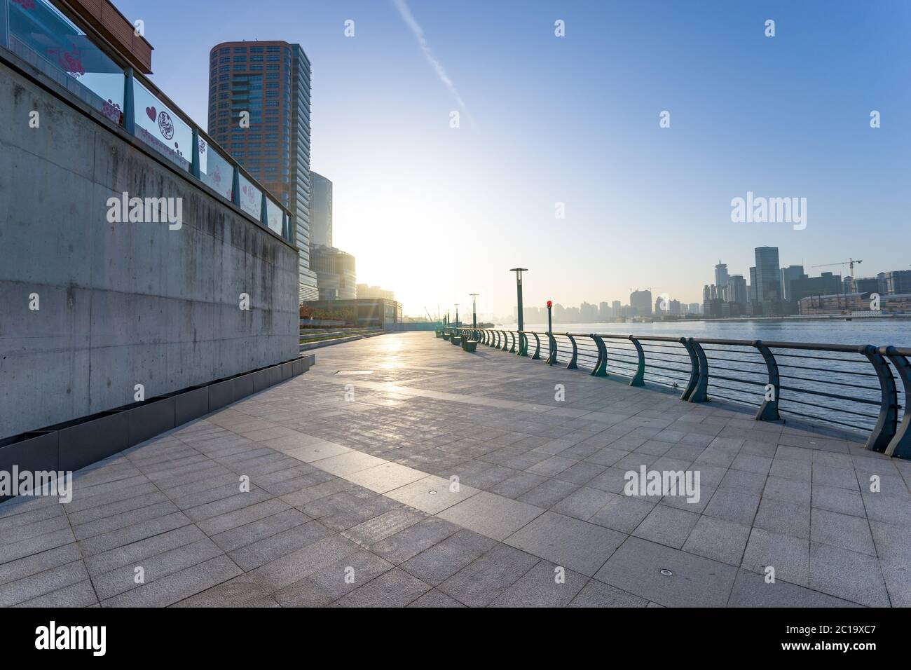 modern buildings near water in modern city Stock Photo - Alamy