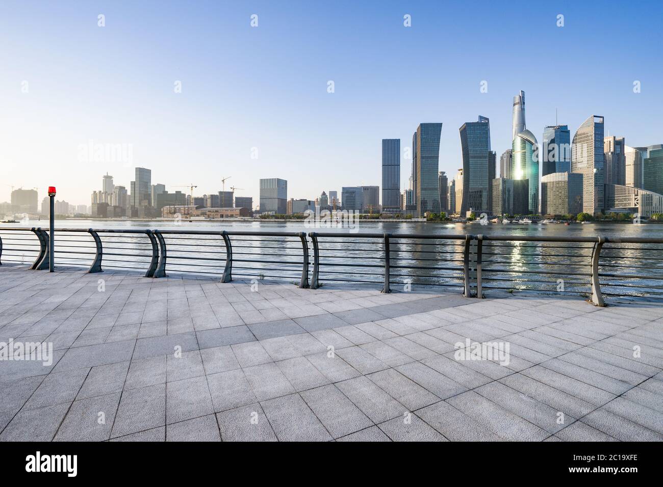 modern buildings near water in modern city Stock Photo - Alamy