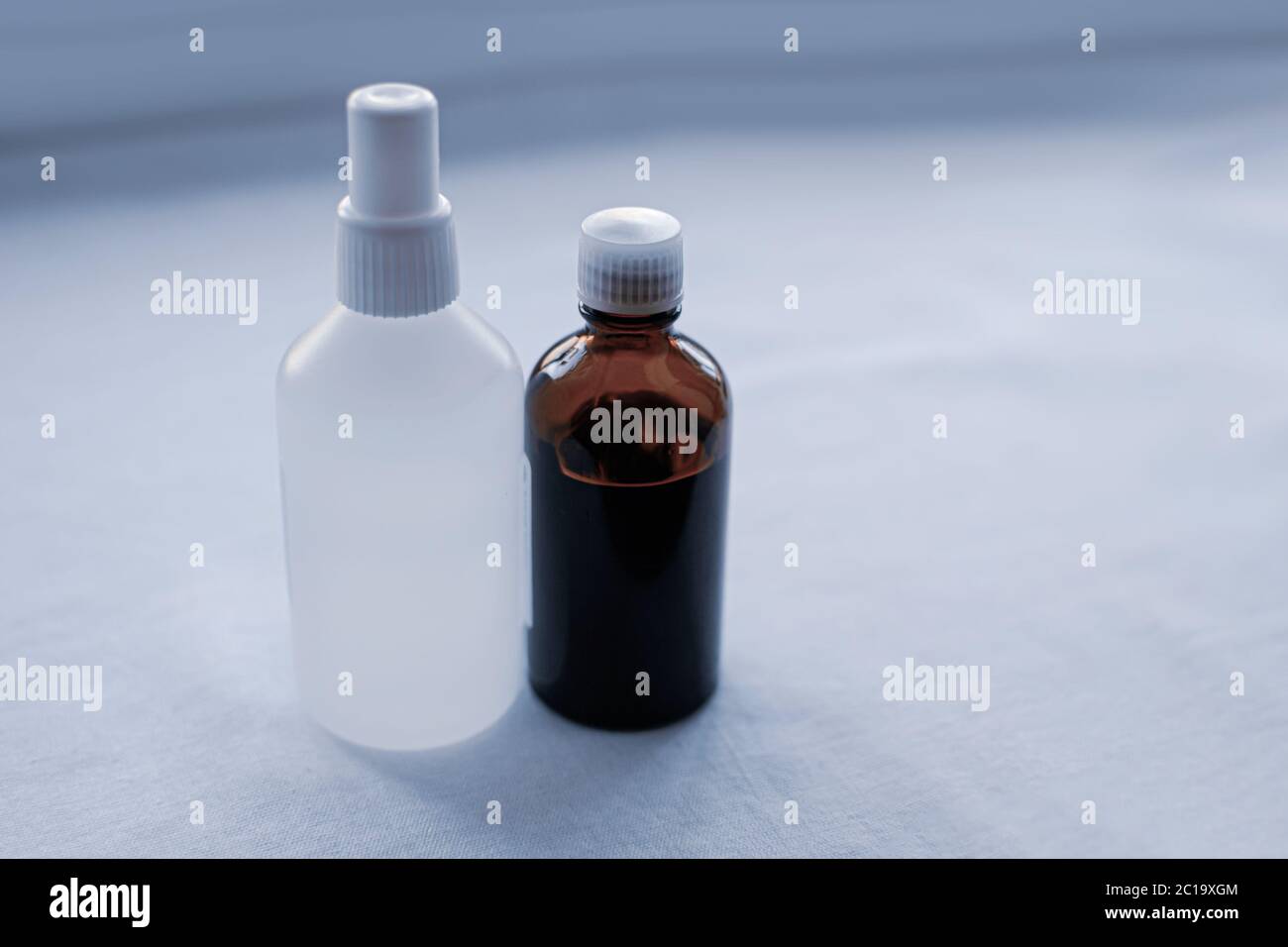 brown and white bottle on a light fabric background. Amber Glass ...