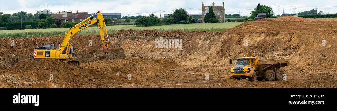 Phase 3 of the Kingsnorth Quarry, Hoo. The excavator digging and ...