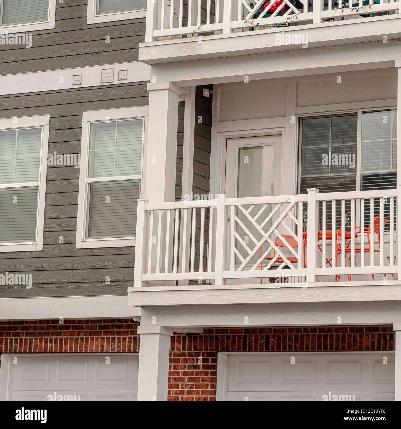 Square Balcony with white iron railing day light Stock Photo - Alamy