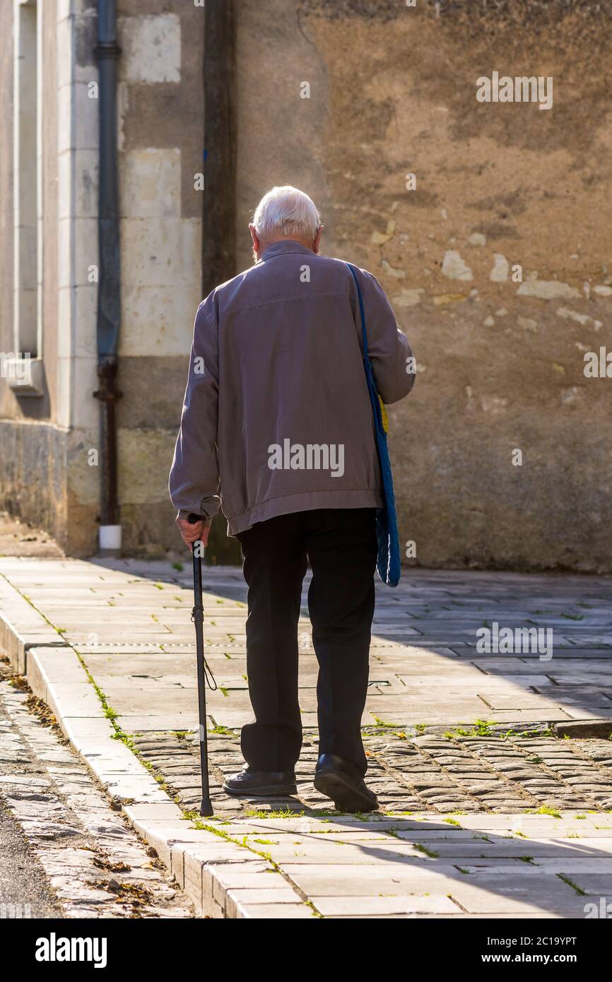 Older man walking alone hi-res stock photography and images - Alamy