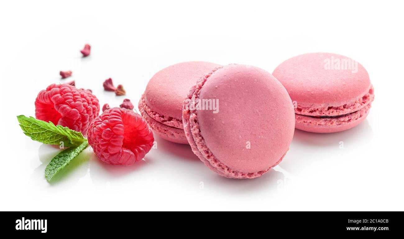pink raspberry macaroons isolated on white background Stock Photo - Alamy