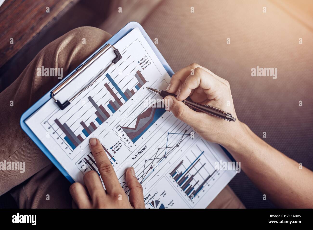 Businessman hold pen and working calculate data. document graph chart ...
