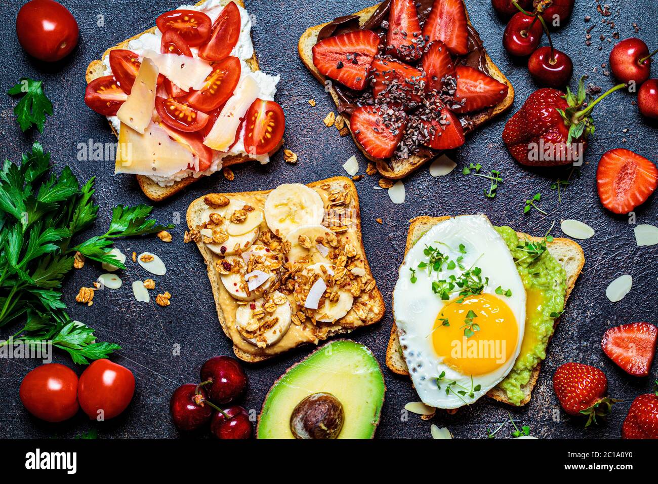 Breakfast different toasts with berries, cheese, egg and fruit, dark ...