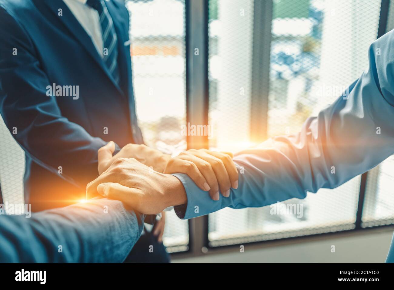 Business team work join hands together. group people hands were ...