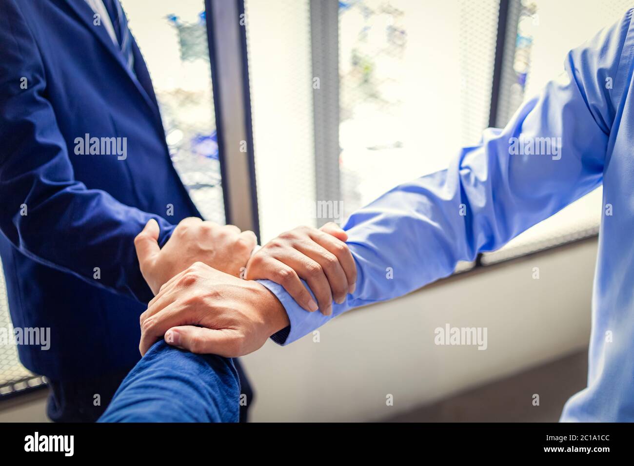 Business team work join hands together. group people hands were ...